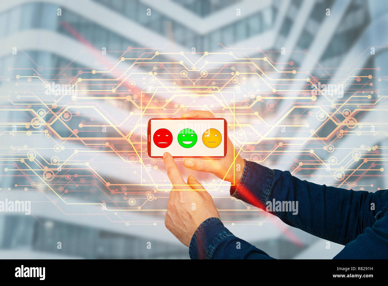 Man hands holding a smartphone touch the screen to choose feedback ...