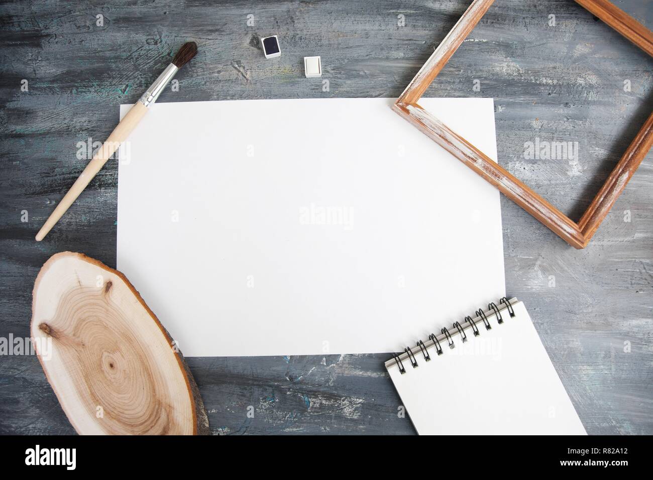 Artistic notepads with empty pages on black wood table background for ...