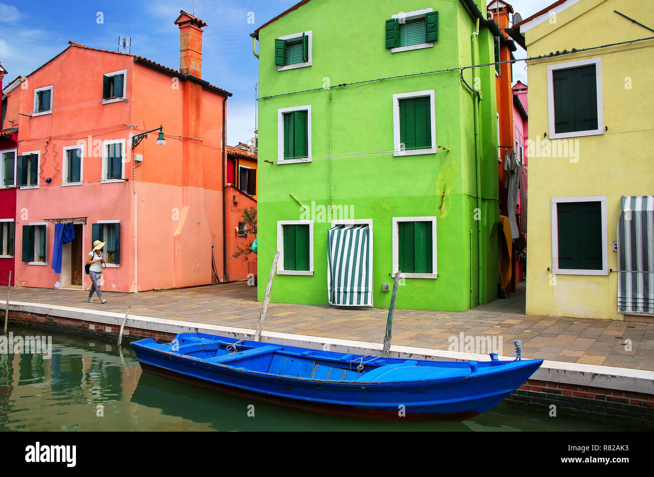 Colorful houses by canal in Burano, Venice, Italy. Burano is an island ...