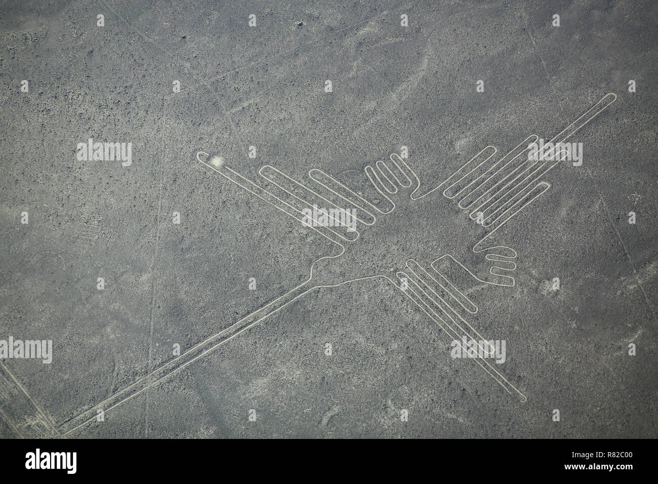 Aerial view of Nazca Lines - Hummingbird geoglyph, Peru. The Lines were ...