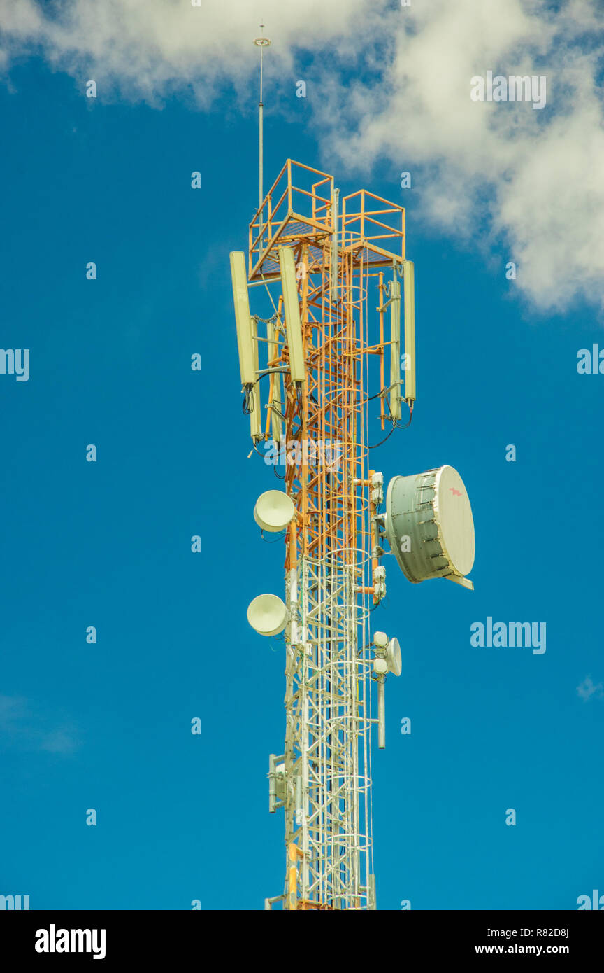 Telecommunication equipment on a blue sky background. Directional ...