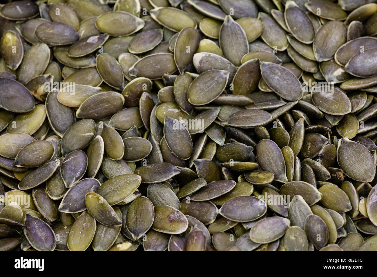 Background made of shelled pumpkin seeds Stock Photo - Alamy