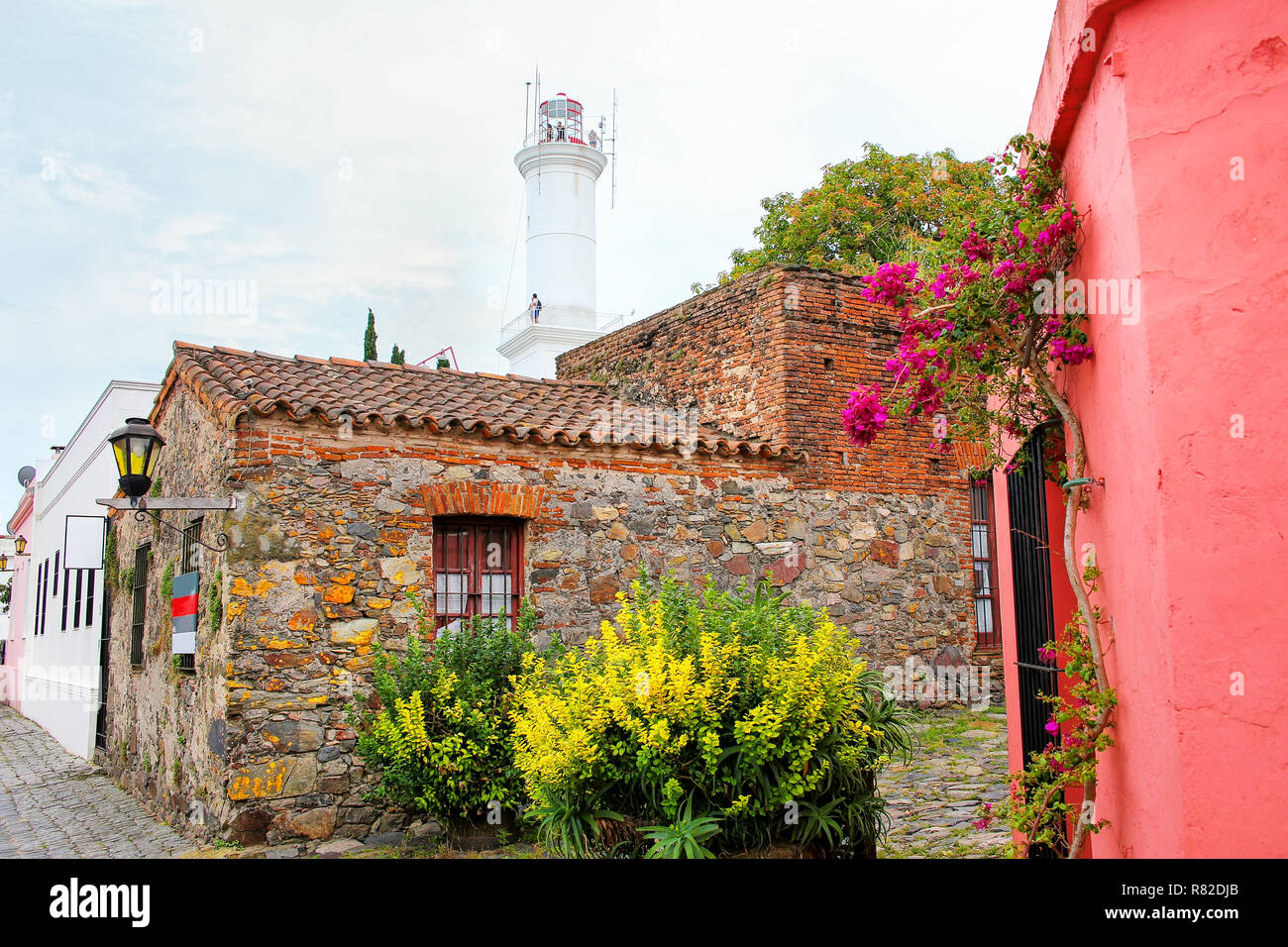 Stone houses and lighthouse in Colonia del Sacramento, Uruguay. It is ...