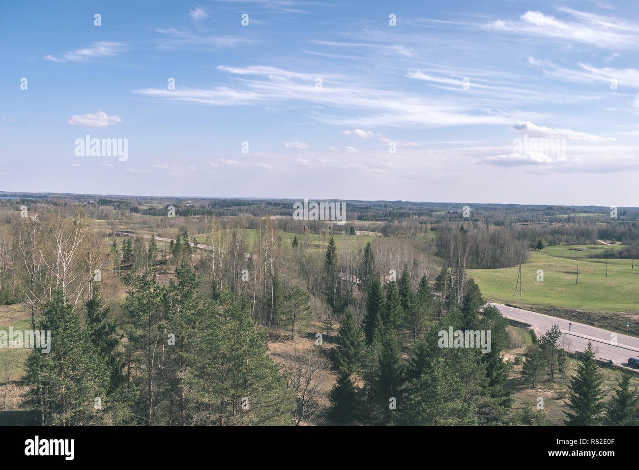 plain simple countryside spring landscape with fresh green meadows and ...