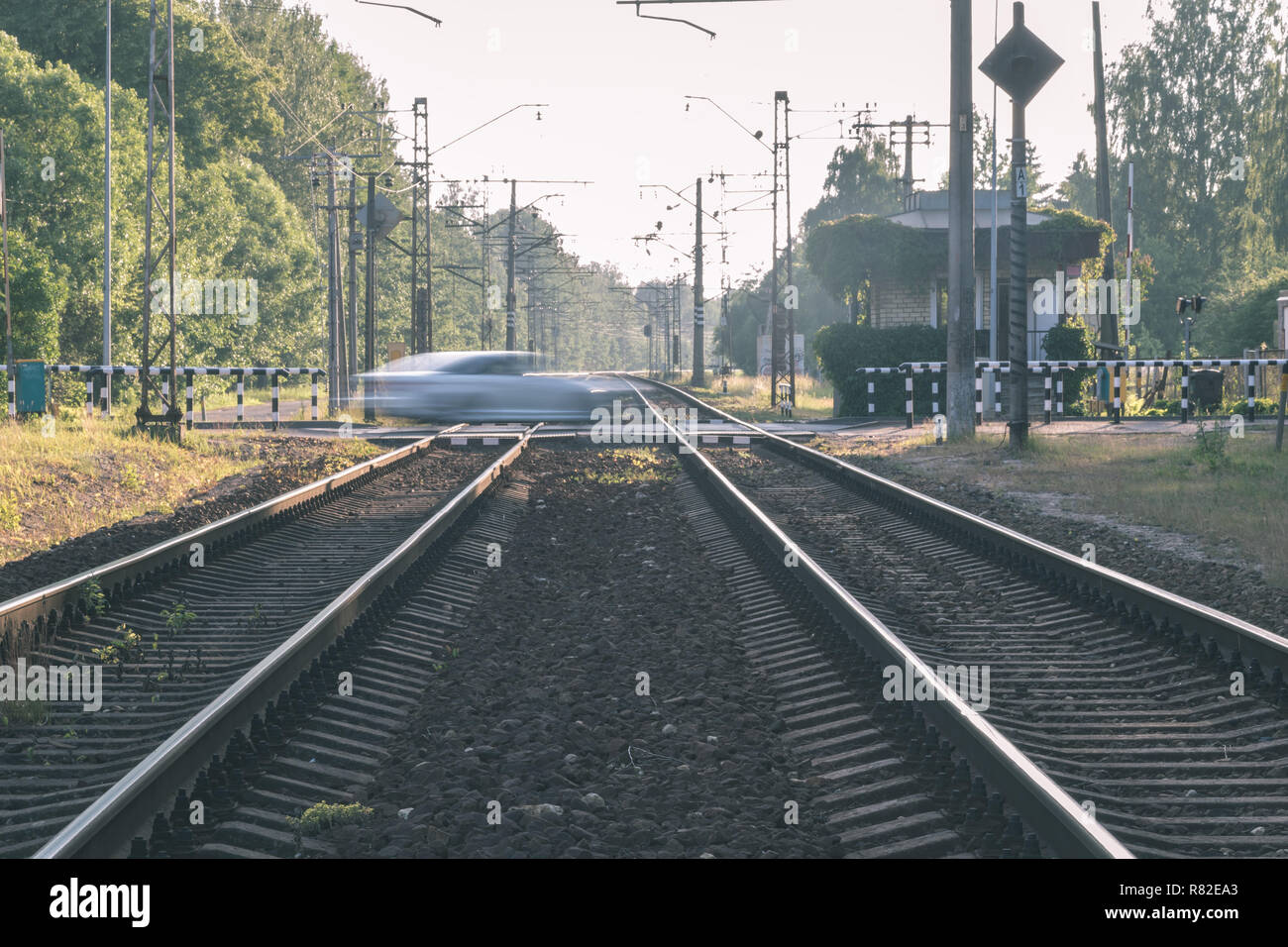 railroad tracks and ground details in summer - vintage retro film look ...