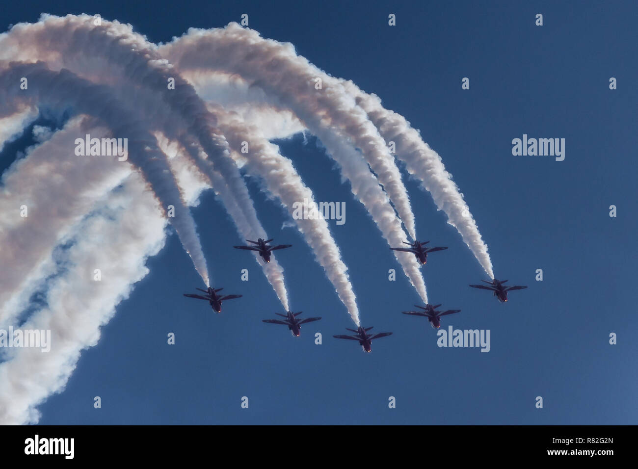 Red Arrows smoke display against blue sky Stock Photo - Alamy