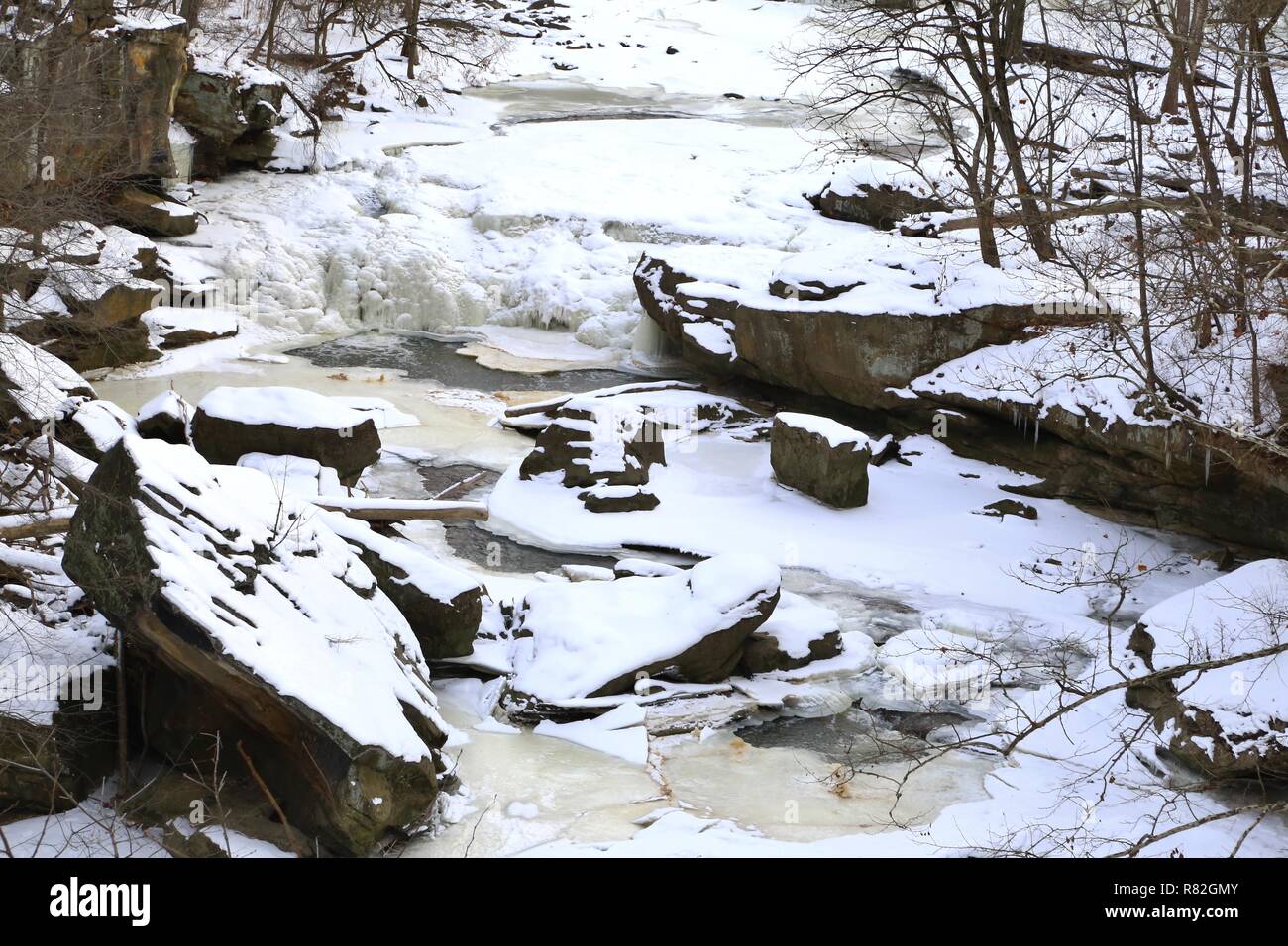 Ice covered stream Stock Photo - Alamy