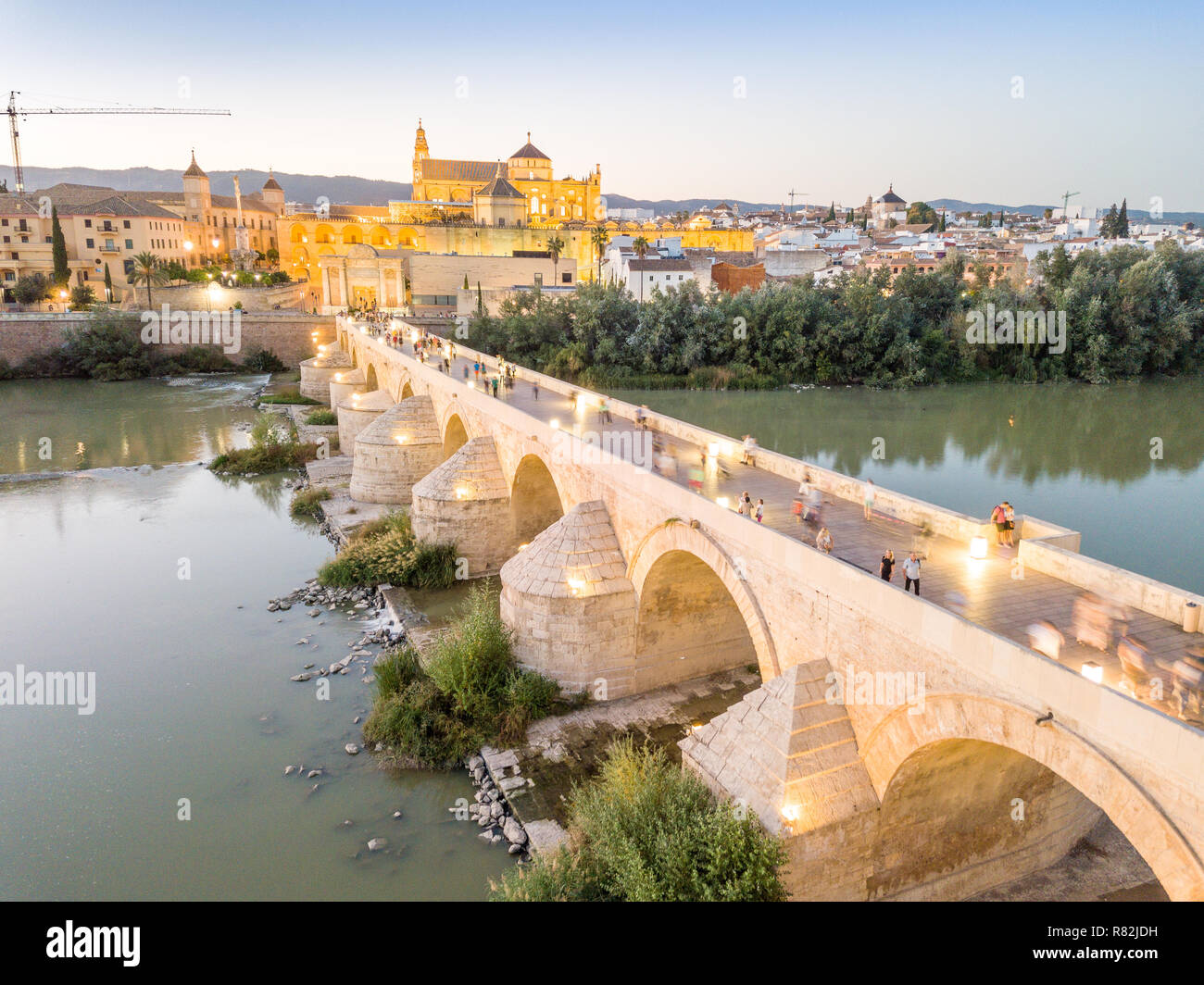 Aerial view of famous Roman bridge and Mosque - Cathedral of Cordoba ...