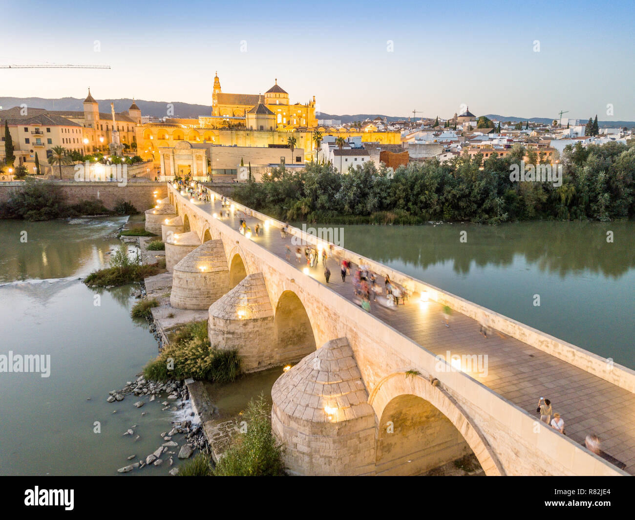 Aerial view of famous Roman bridge and Mosque - Cathedral of Cordoba ...