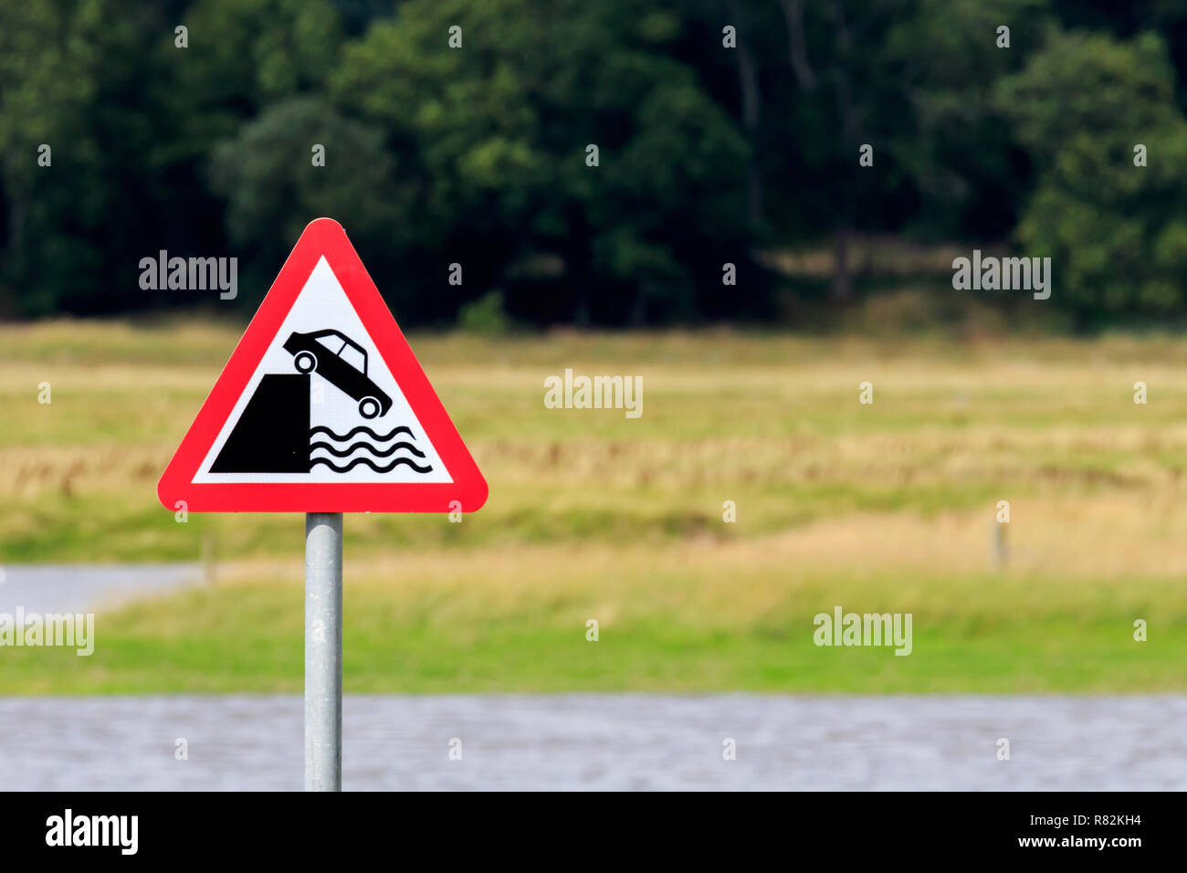 Warning road sign for Quayside or River Bank Stock Photo - Alamy