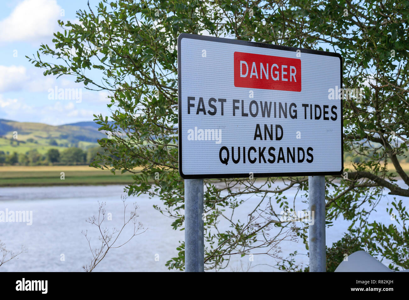 Danger sign warning if fast flowing tides and quicksands Stock Photo ...