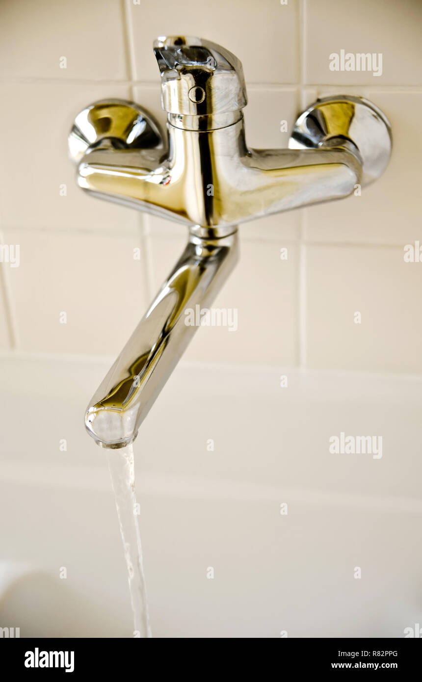 a silver water tap in the bathroom Stock Photo - Alamy