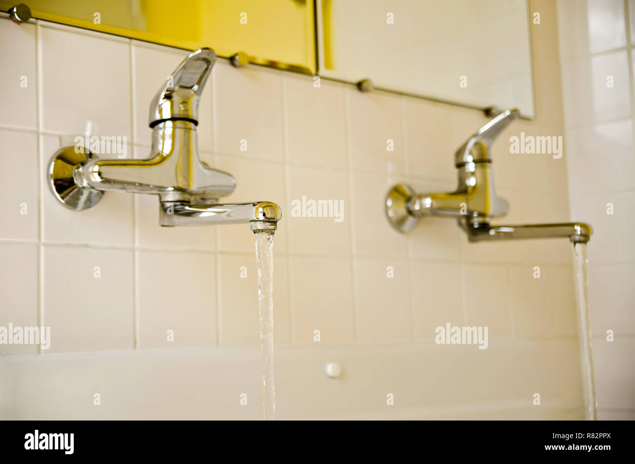 a two water taps in the bathroom Stock Photo - Alamy