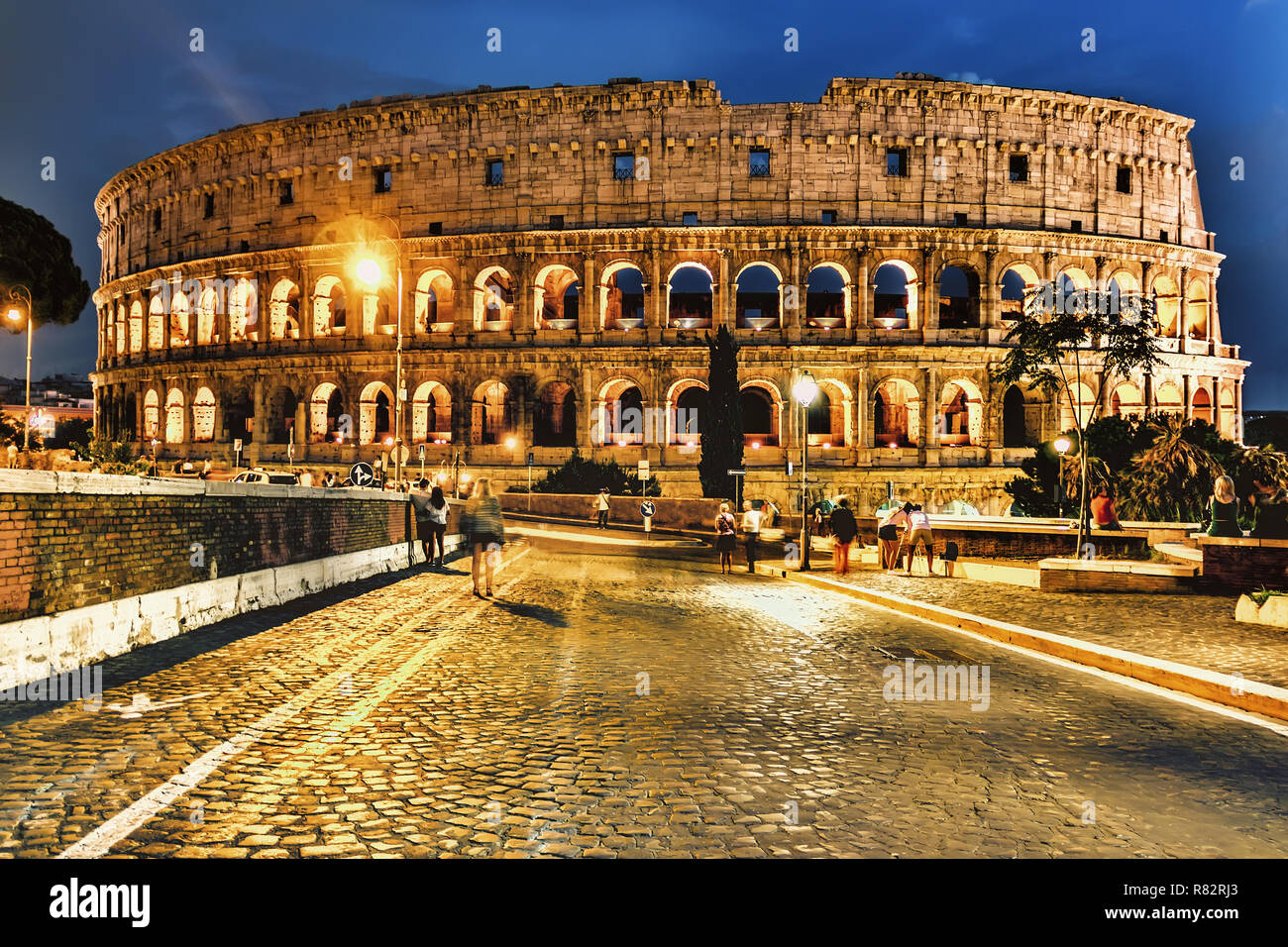 The Colosseum night view from the road Stock Photo - Alamy