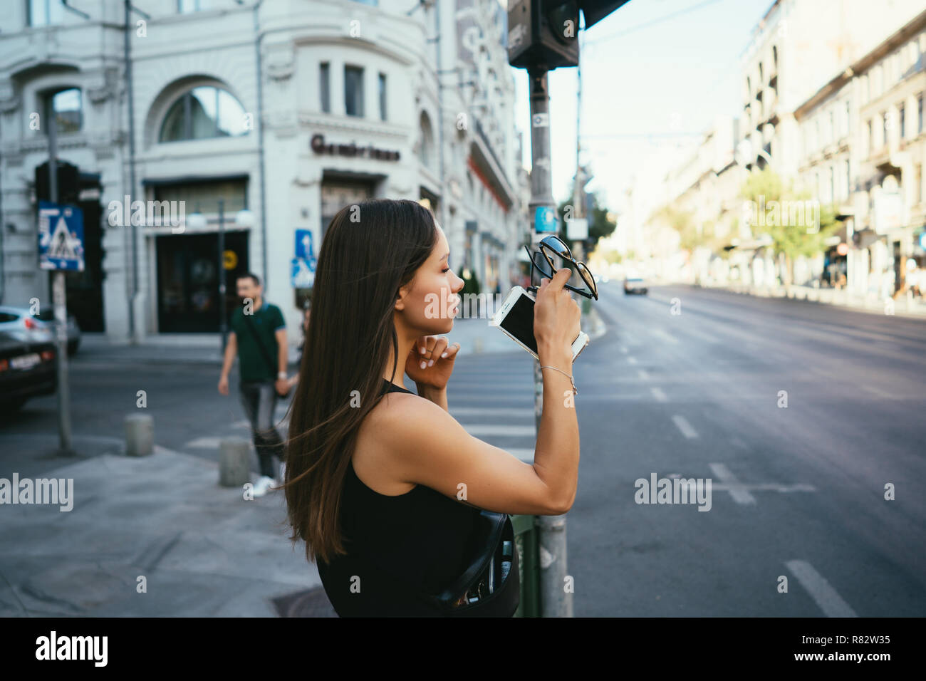 A beautiful young girl is standing at a crossroads Stock Photo - Alamy