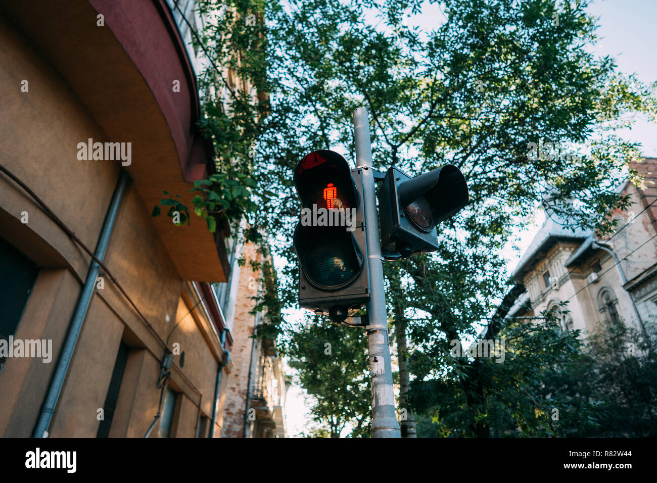 Urban, street traffic lights. The red sign for pedestrians is lit Stock ...