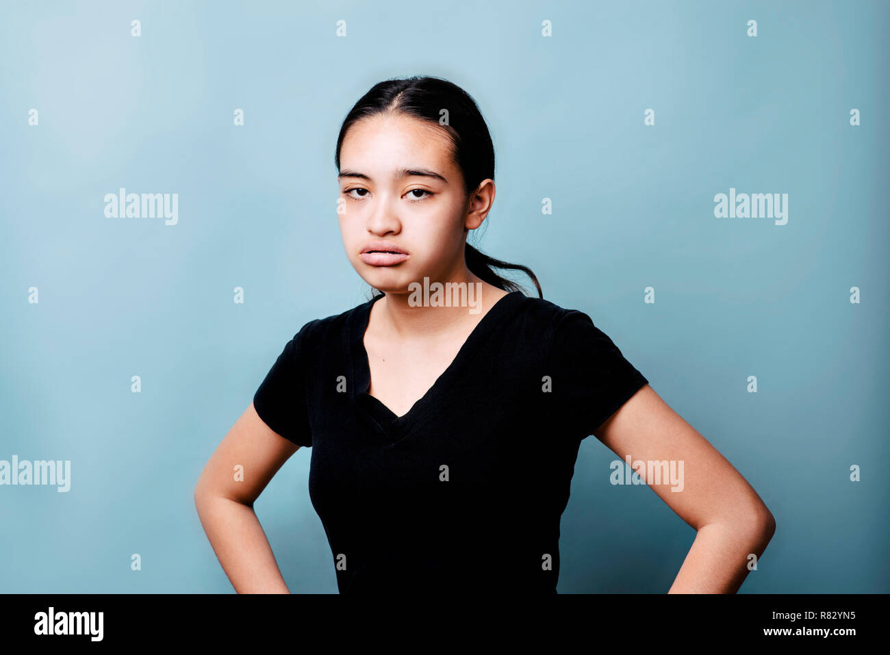 Female teen shows emotions of frustration, anger, sadness, loss and ...