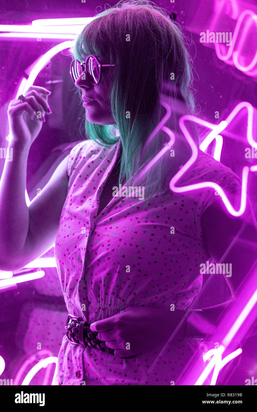 Cinematic Portrait of girl with sunglasses on neon lights and ...