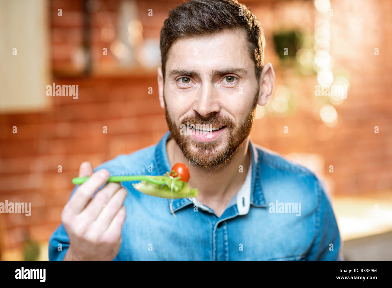Handsome man eating healthy food hi-res stock photography and images ...