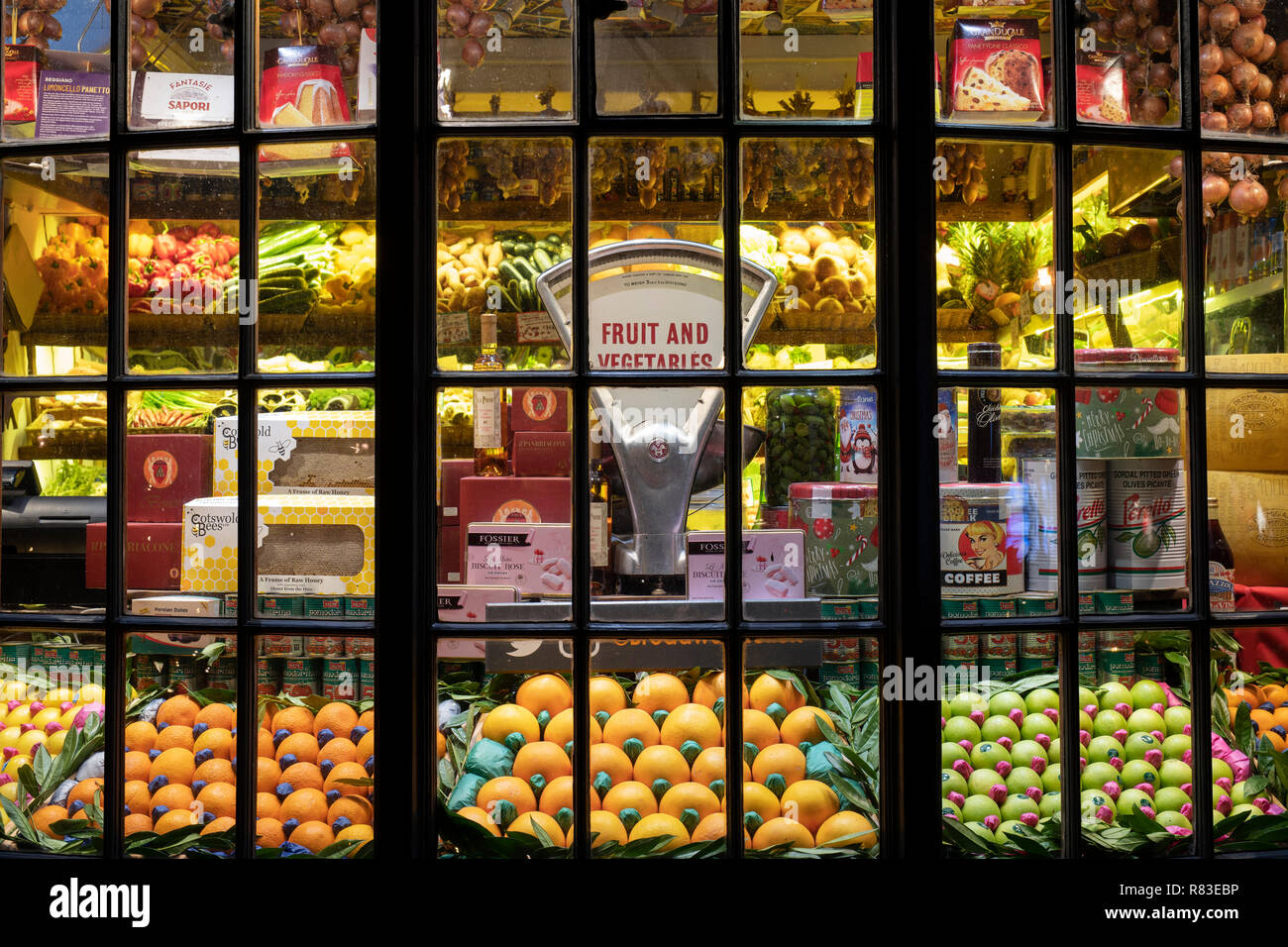 The Broadway Deli fruit and vegetable window display at night. Broadway ...