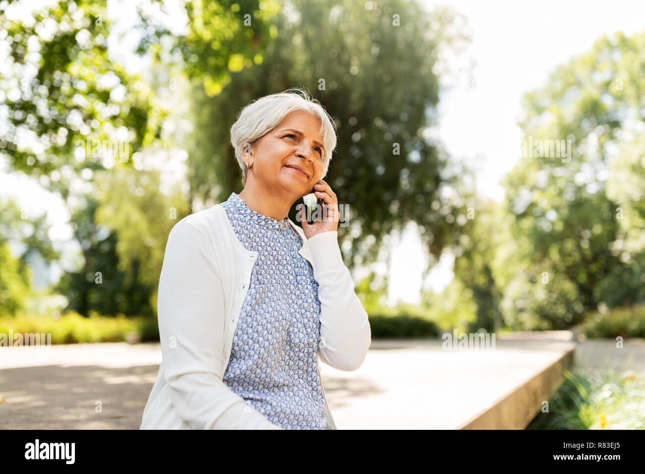 Happy mature woman calling hi-res stock photography and images - Alamy
