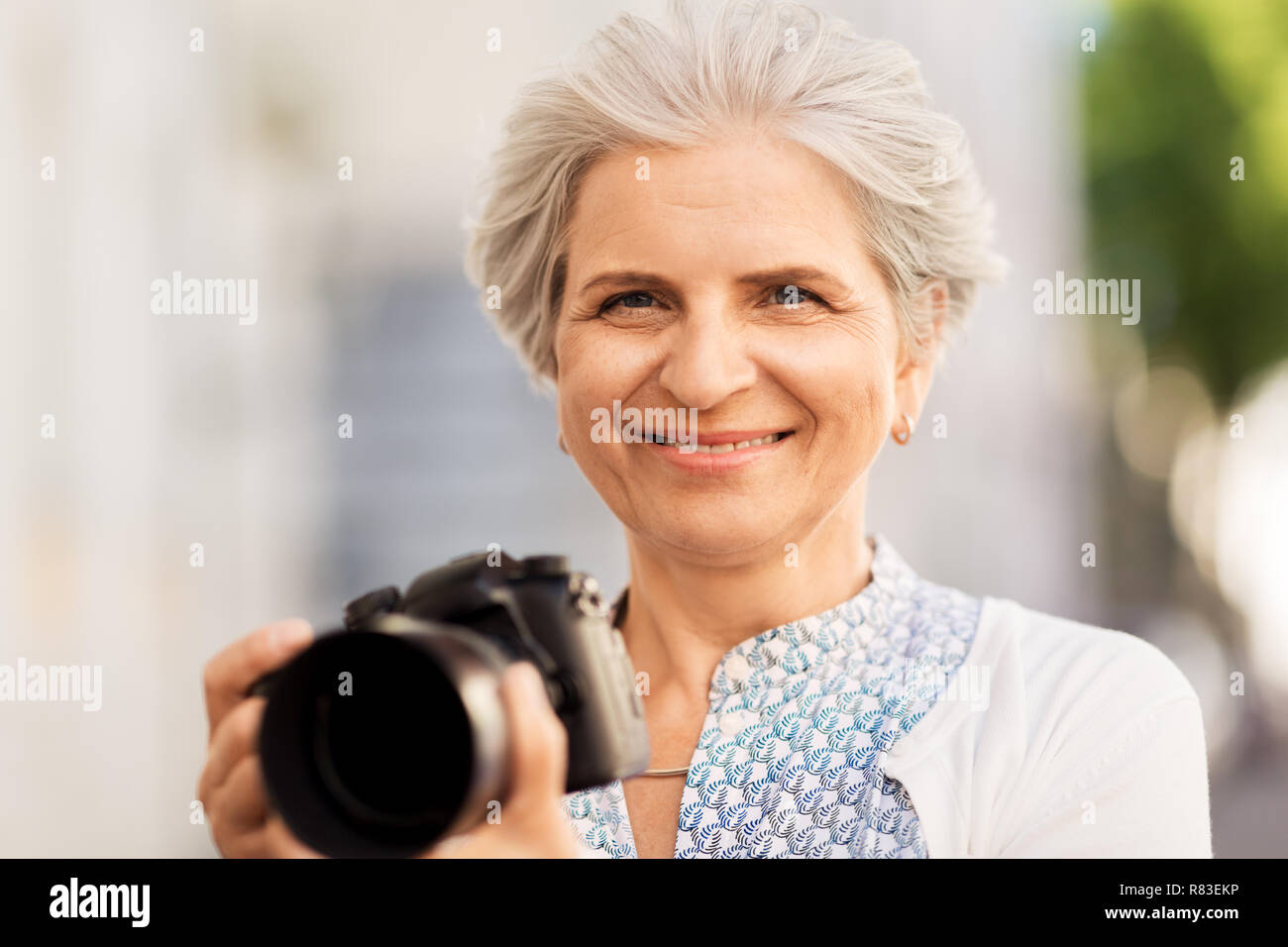 senior woman photographing by digital camera Stock Photo - Alamy