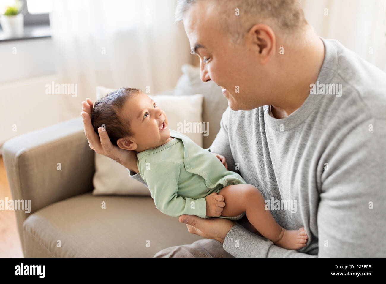 happy father with little baby boy at home Stock Photo - Alamy