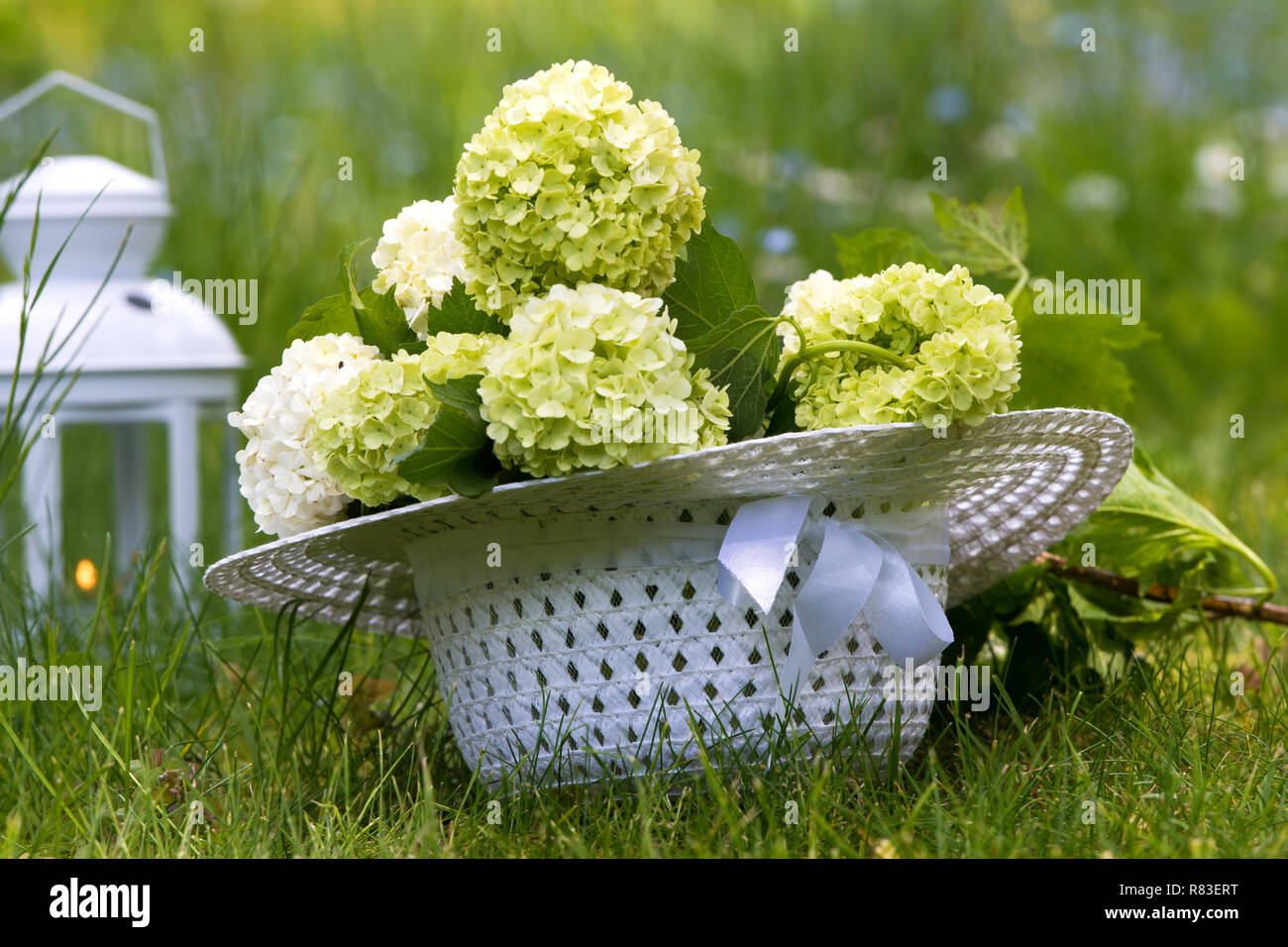 Idyllic garden with flowers and lantern Stock Photo - Alamy