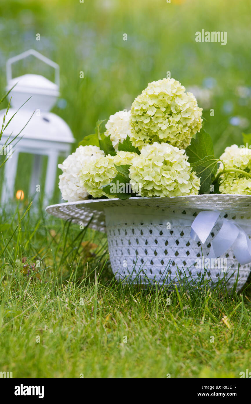 Idyllic garden with flowers and lantern Stock Photo - Alamy