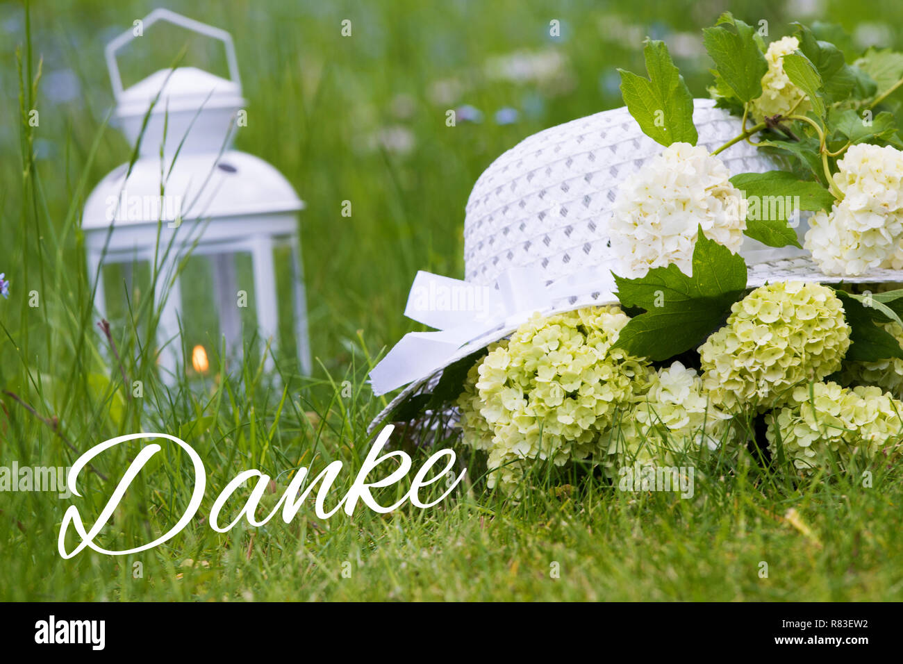 Idyllic garden with flowers and lantern Stock Photo - Alamy