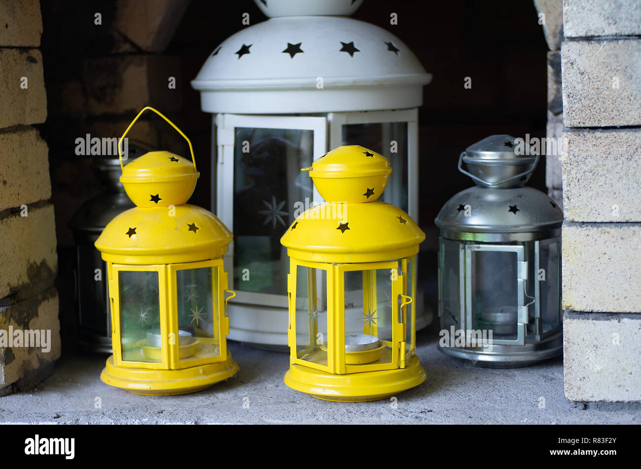 Yellow and white candlesticks made of metal. Candlestick in the form of ...