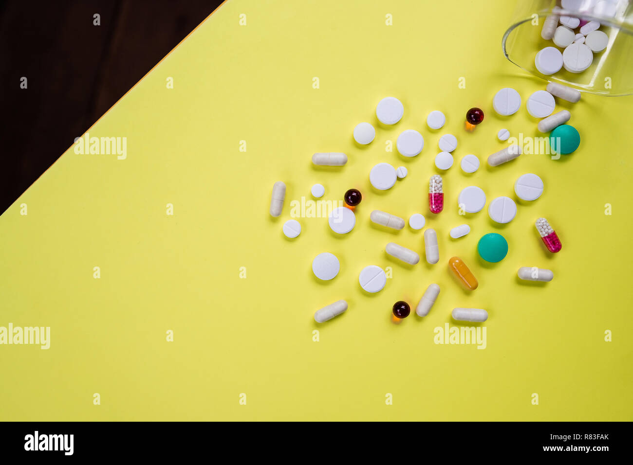Control, support, Pill on yellow background. Colored Pills And Capsule ...