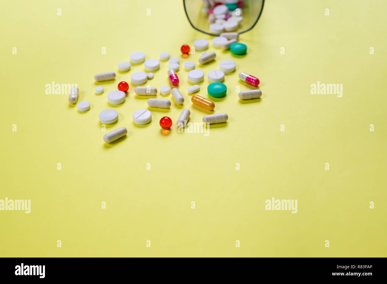Control, support, Pill on yellow background. Colored Pills And Capsule ...