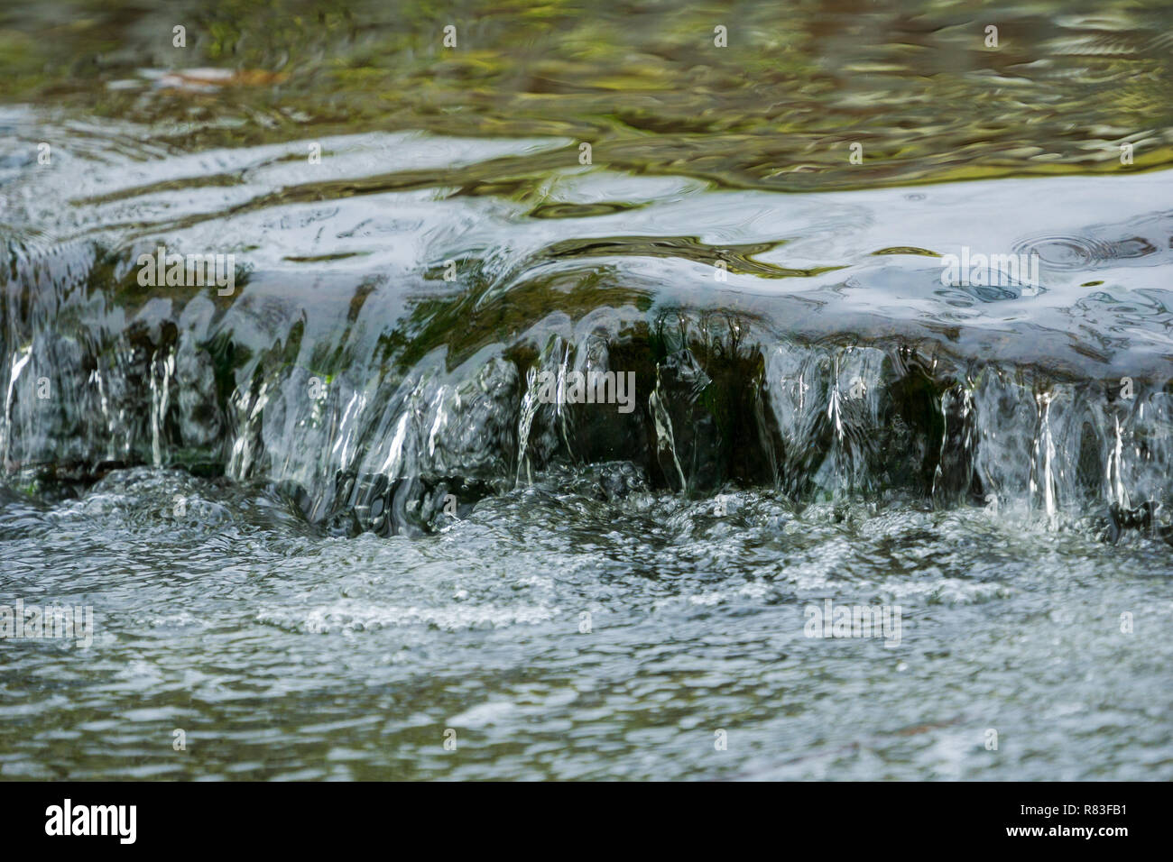 Close-up of a beautiful flowing River with clear fresh Mountain Water ...