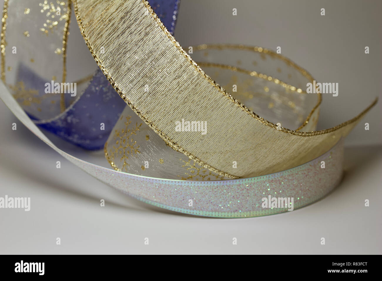 Abstract macro background of beautiful gold colored fabric ribbon with ...