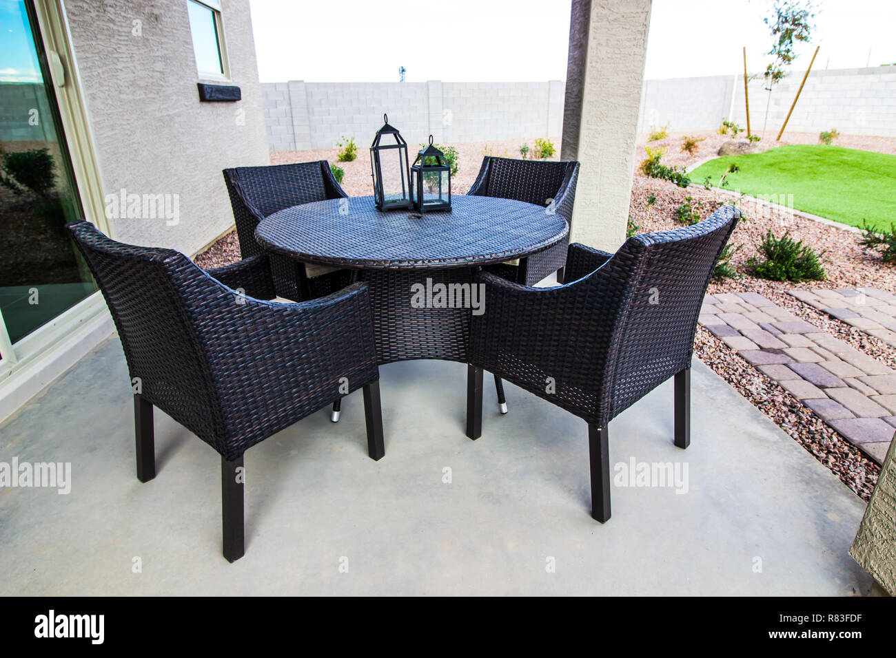 Black Wicker Table And Chairs On Outdoor Patio Stock Photo - Alamy