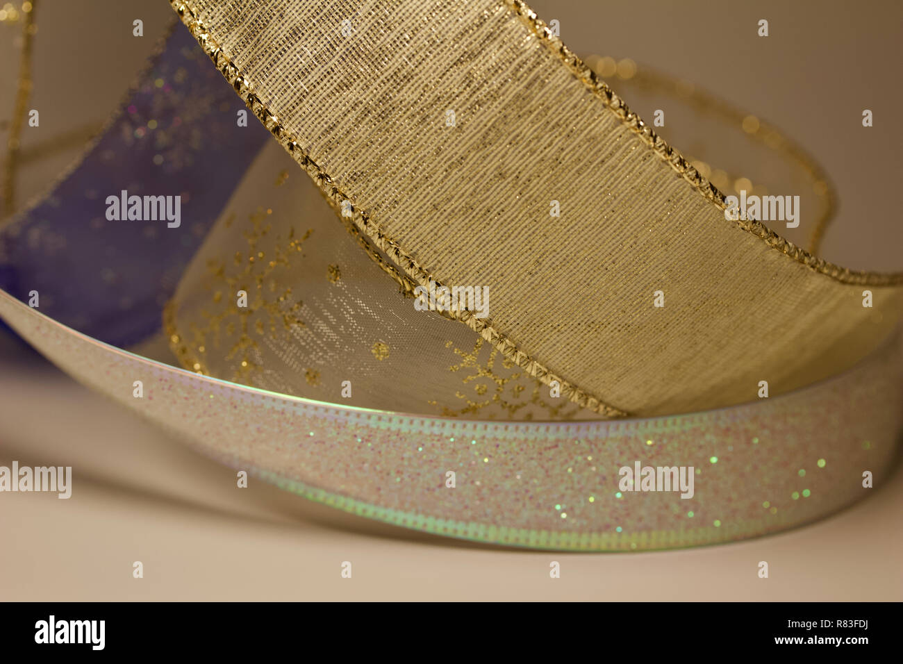 Abstract macro background of beautiful gold colored fabric ribbon with ...