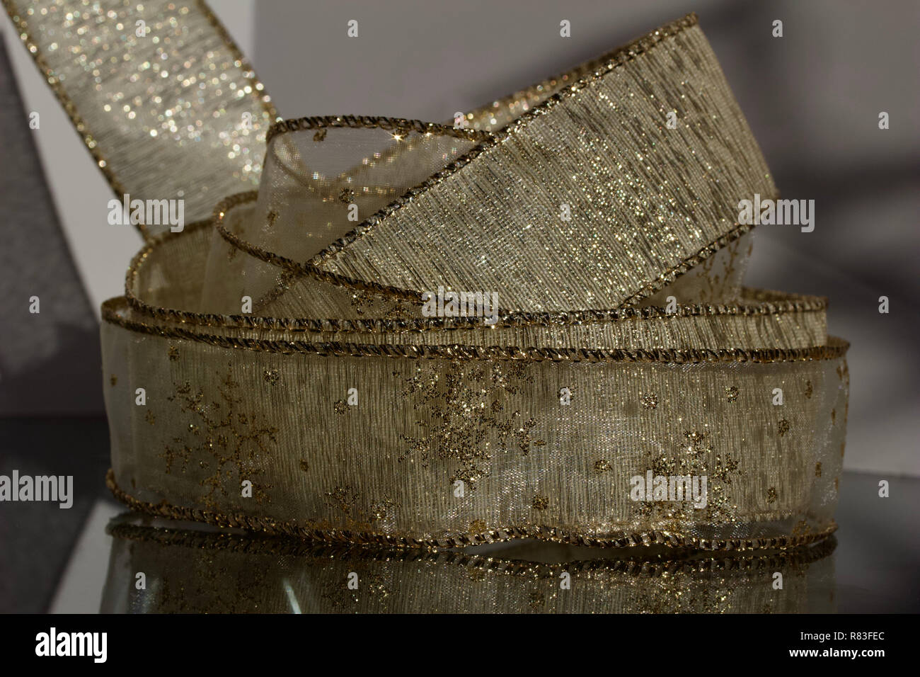 Abstract macro background of beautiful gold colored fabric ribbon with ...