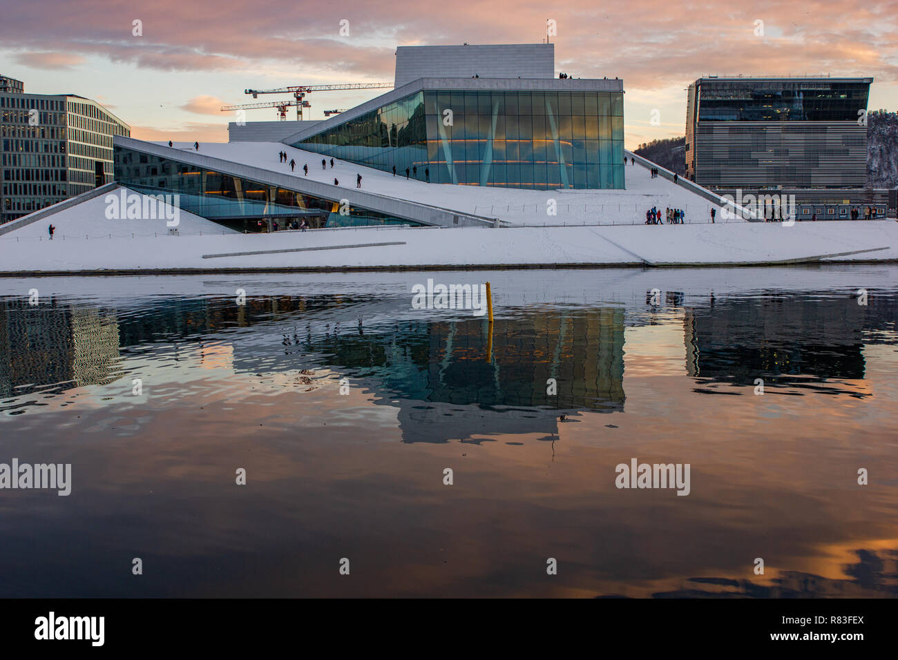 Norwegian Opera house and new Munch museum in construction at sunset in ...