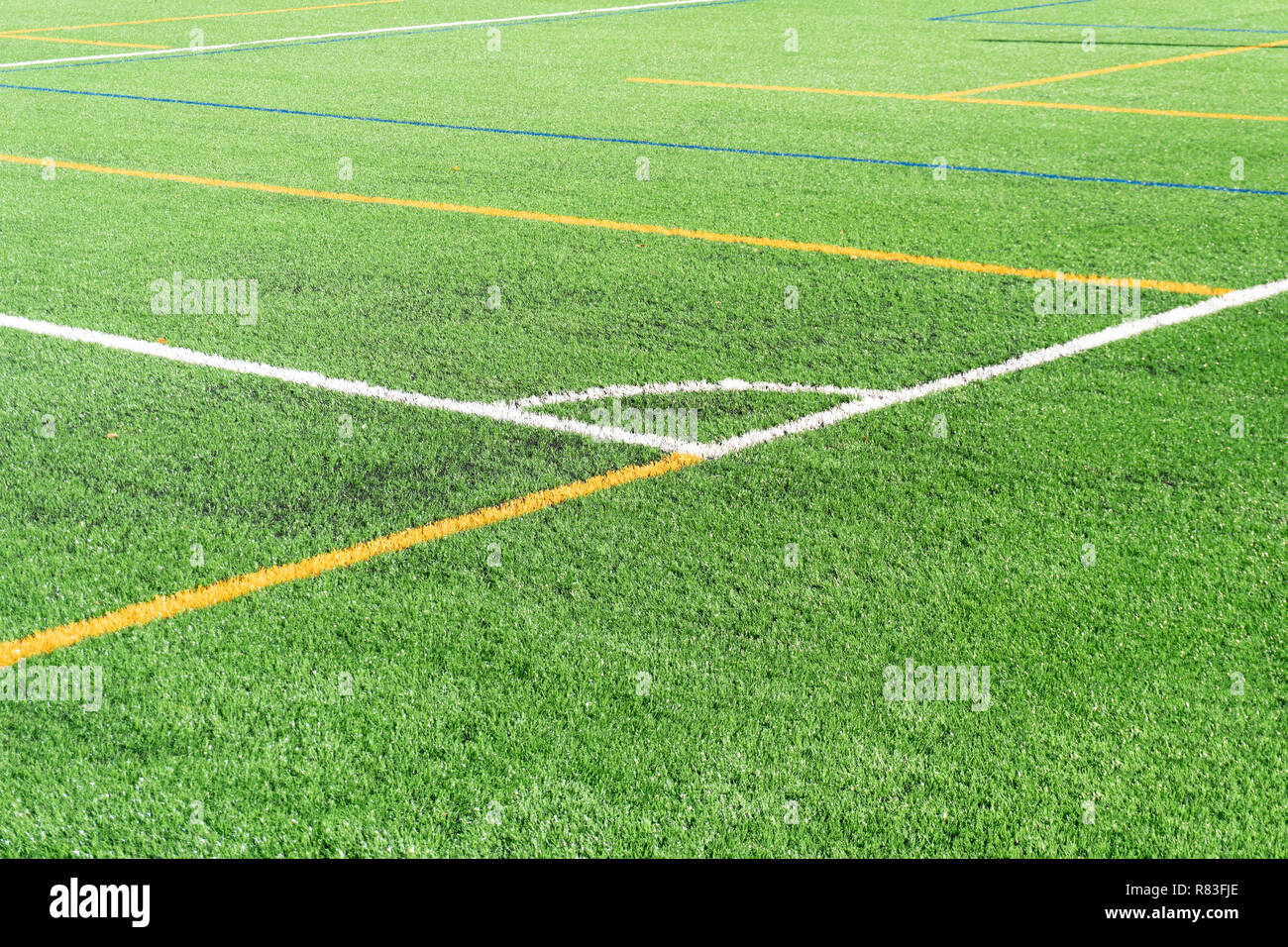 Soccer field with a new artificial turf field, white corner marking ...