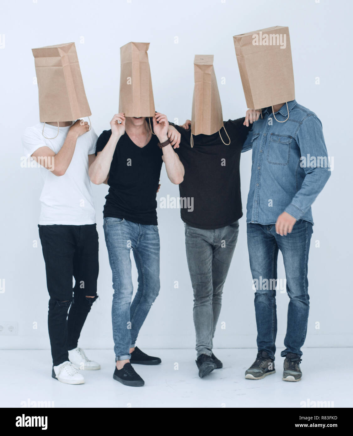 group of young people with paper bags on their heads Stock Photo - Alamy