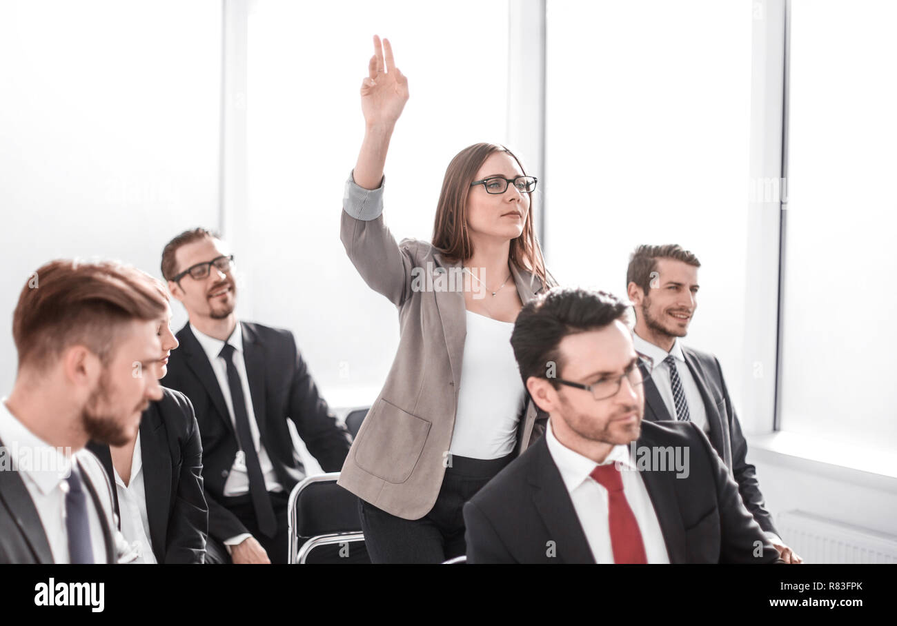 business woman asks a question at a business meeting Stock Photo - Alamy