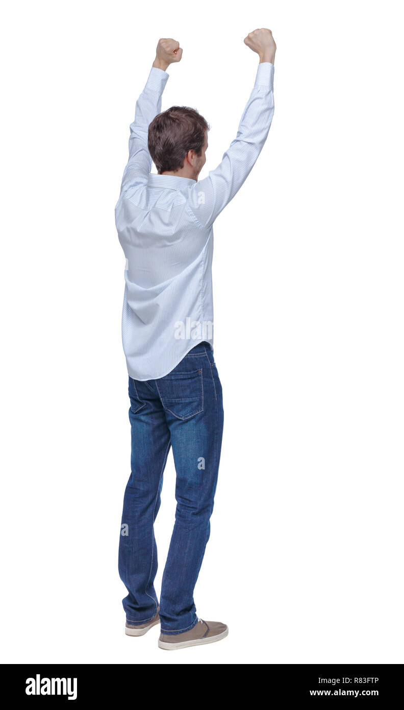 Back view of a man celebrating victory. The fan joyfully raised his ...