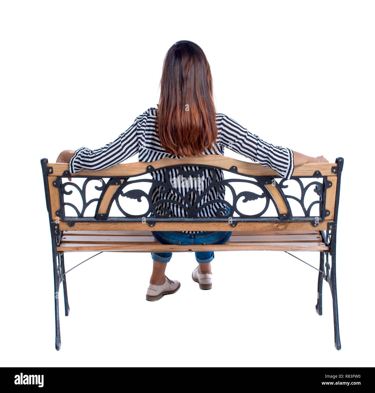 Back view of a woman sitting on a bench. girl watching. Rear view ...