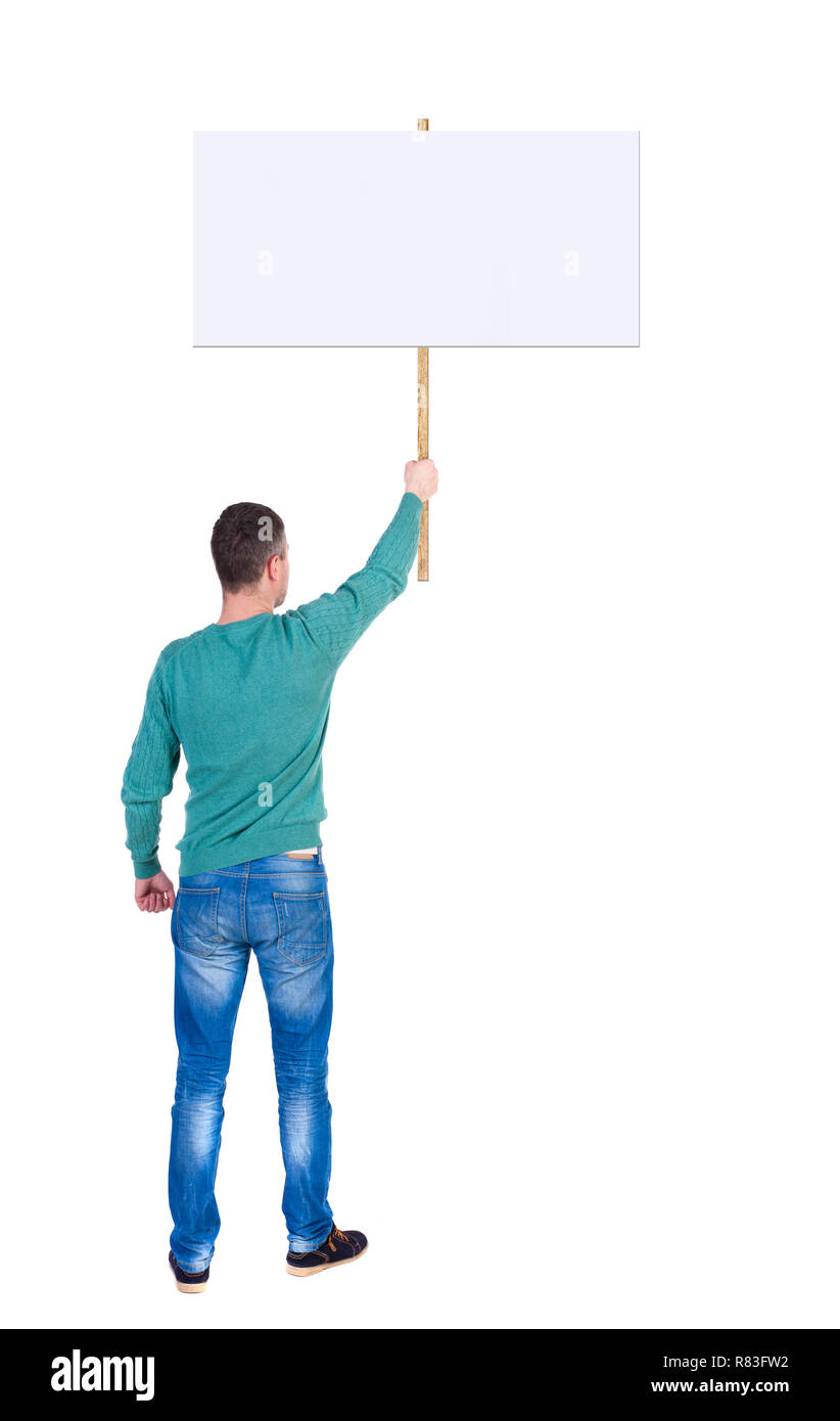 Back view man showing sign board. man holds information plate. Rear ...