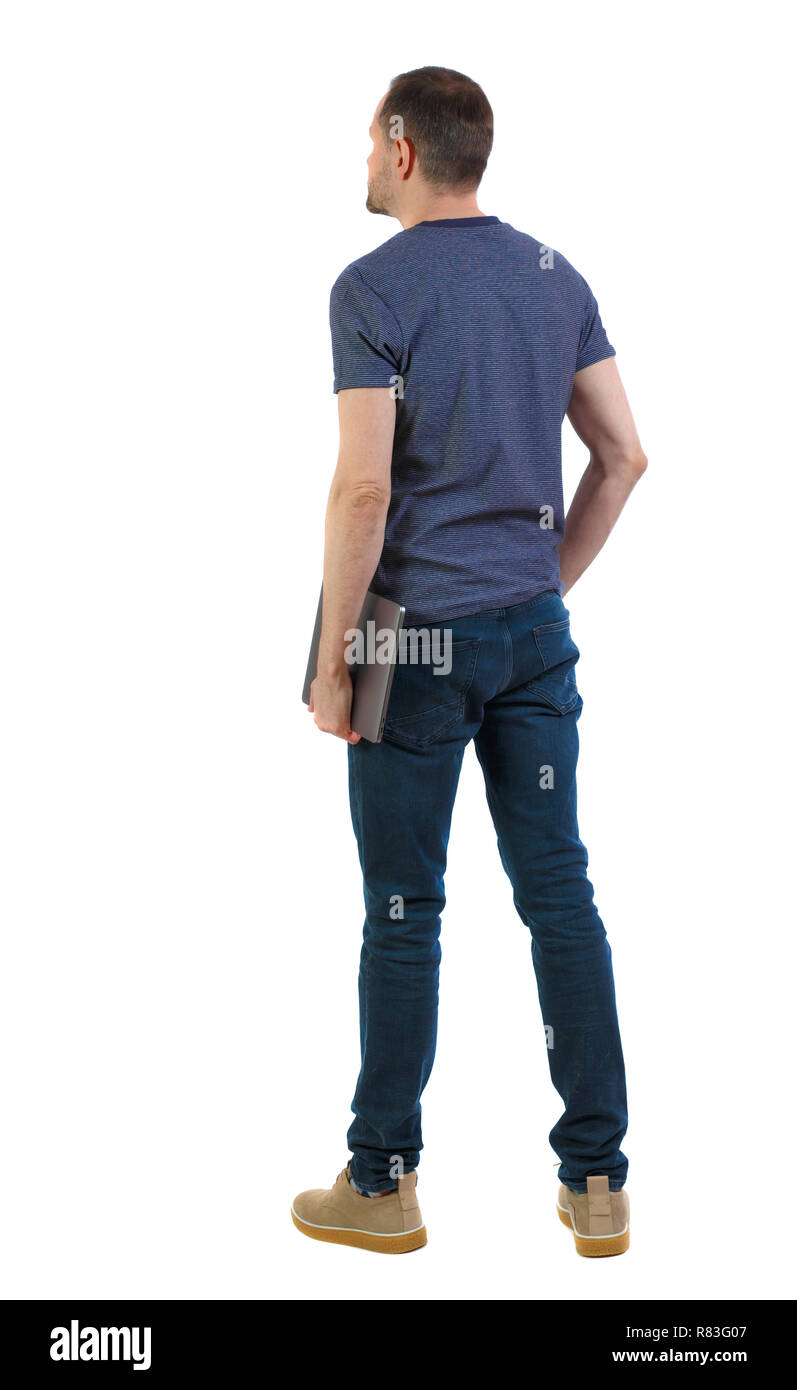 Back view of a man who is standing with a laptop. Rear view people ...