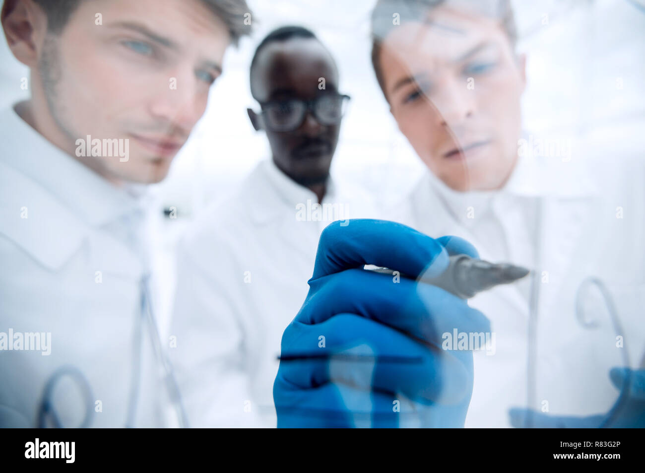 close up.a group of scientists discussing new ideas Stock Photo - Alamy