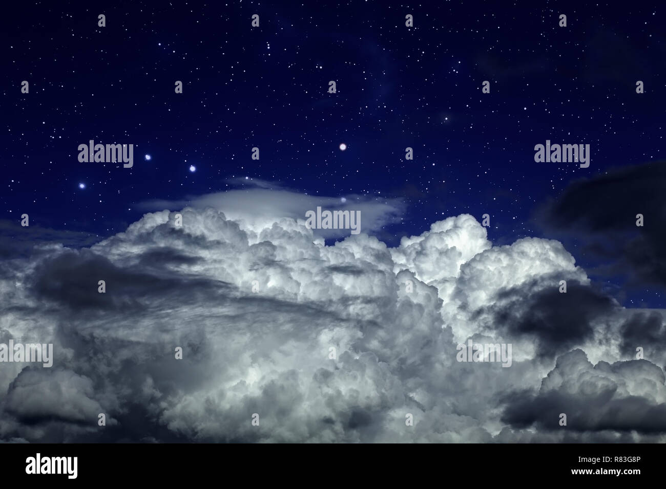 Starry night sky with strong clouds in the foreground Stock Photo - Alamy