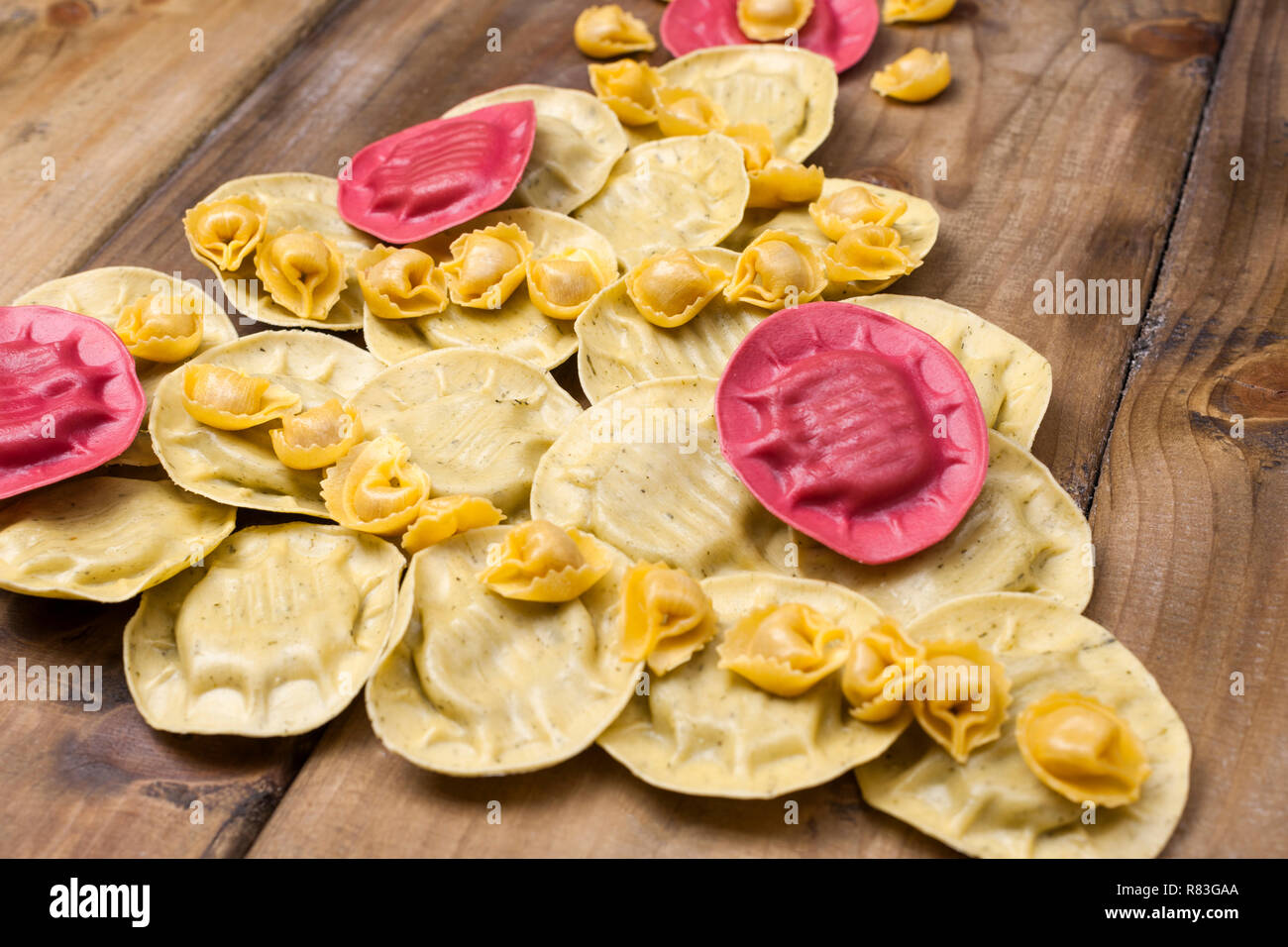 Ravioli like christmas tree on wooden background. Holidays in Italy ...