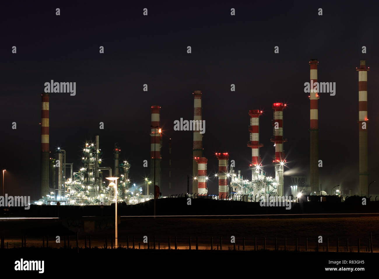 Part of a big oil refinery and power-plant by night Stock Photo - Alamy